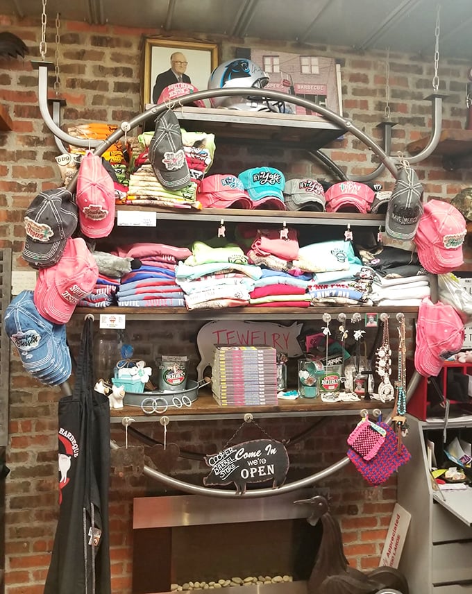 The merchandise corner proves that barbecue isn't just a meal—it's an identity worth wearing on hats, shirts, and apparently, jewelry.