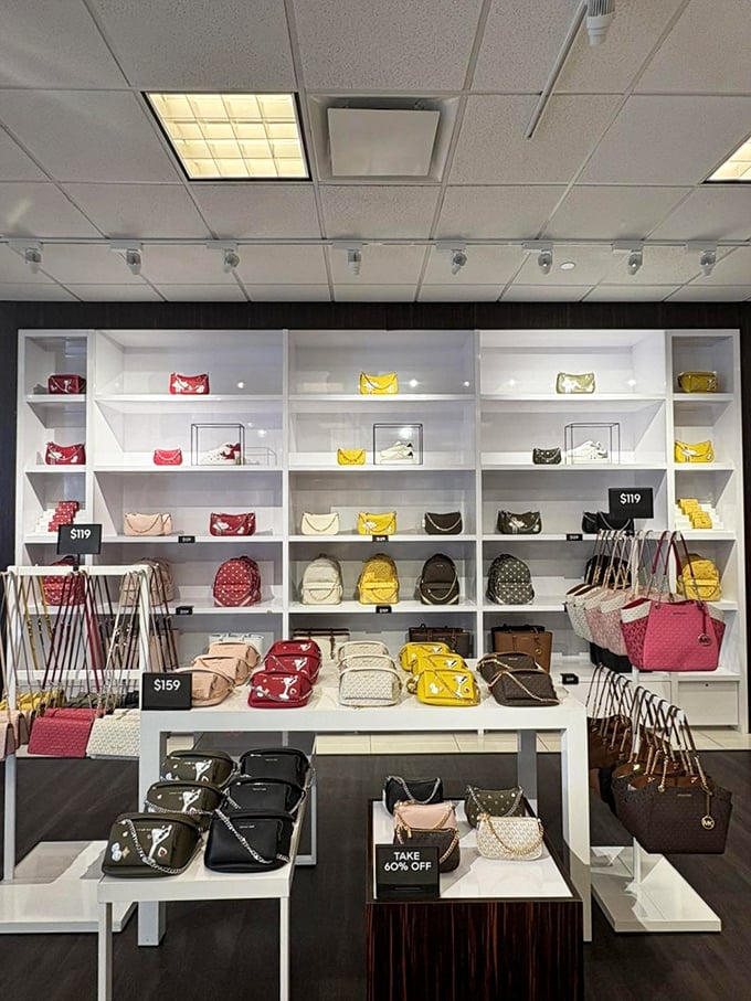 The Michael Kors handbag display—where wallets come to empty themselves in exchange for arm candy that screams "I've arrived!"