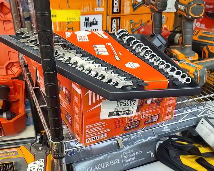 Tools so neatly arranged they'd make Marie Kondo weep with joy. The Milwaukee and DeWalt sections engage in a silent battle of red versus yellow.
