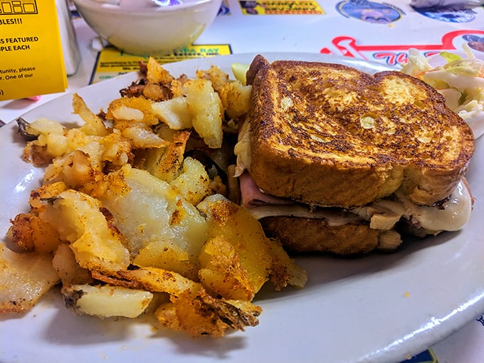 The Monte Cristo – where French toast decided to have an identity crisis and become a sandwich. Sweet, savory, and worth every napkin you'll need.