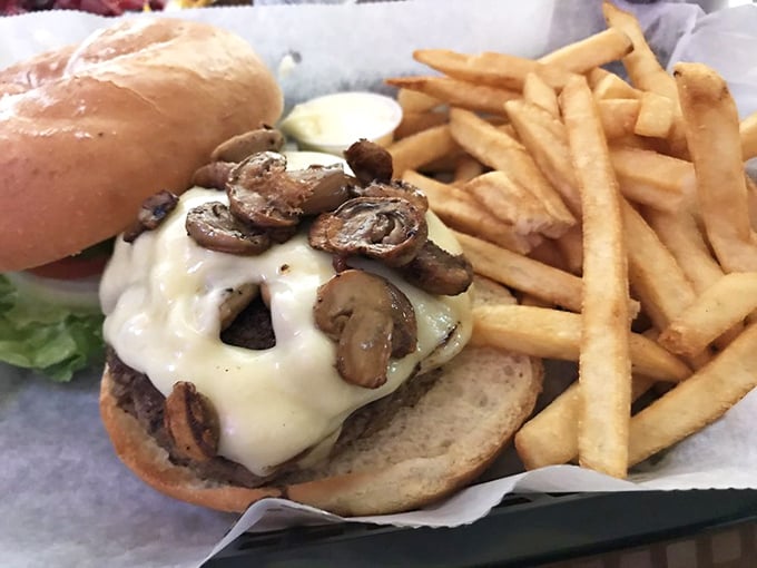 The Swiss mushroom burger doesn't need fancy aioli or artisanal buns—it lets the melty cheese and earthy mushrooms do all the talking.