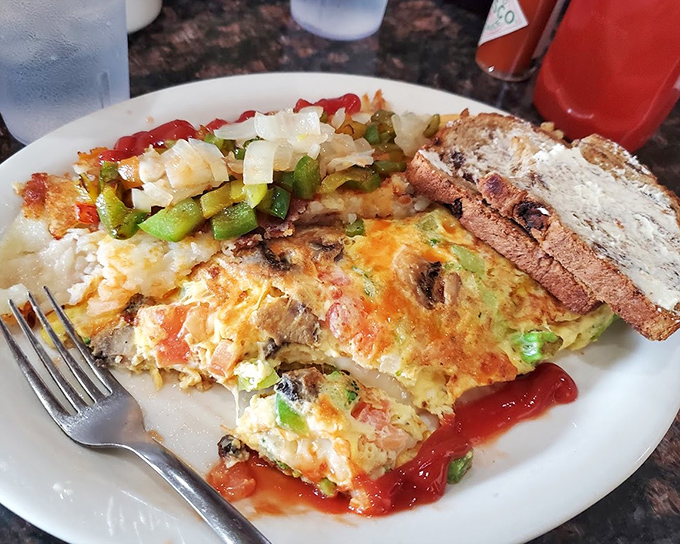 This isn't just an omelet—it's a technicolor dream of vegetables and cheese that makes plant-eating feel like a celebration.