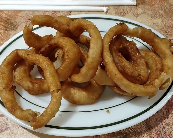 Onion rings with the perfect crunch-to-softness ratio—the kind that make you forget onions were ever meant to be eaten any other way.