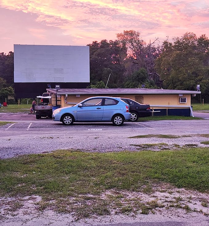 Sunset paints the perfect backdrop for the concession stand, where movie snacks somehow taste better than anywhere else on earth.