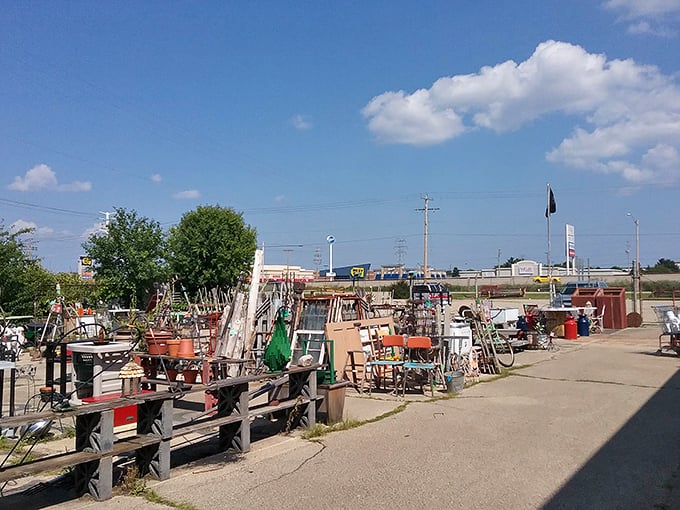 The outdoor overflow area – where garden treasures and architectural salvage bask in Wisconsin sunshine, waiting for their forever homes.