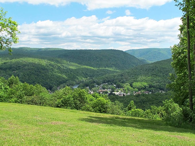 The rolling Laurel Highlands cradle tiny Ohiopyle in a verdant embrace, proving that sometimes the best views require a little elevation.