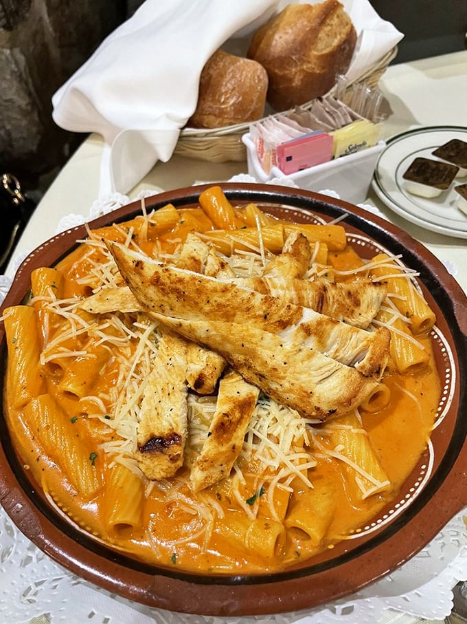 Pasta that's having an identity crisis in the best possible way. This Portuguese-Italian fusion with its sunset-colored sauce makes carb-loading a noble pursuit.