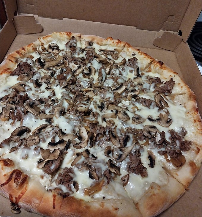 Mushrooms and steak playing together on a pizza playground. This isn't fusion cuisine—it's a delicious friendship that makes perfect sense.
