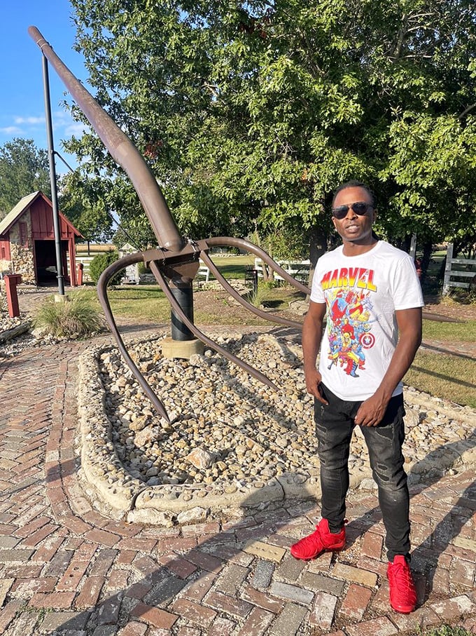 Every visitor seems compelled to strike a pose—this supersized farm implement has become the ultimate Midwestern selfie backdrop.