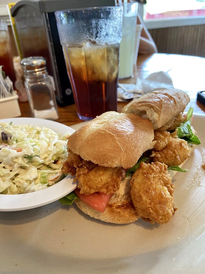 This fried chicken sandwich with homemade slaw isn't just lunch – it's an afternoon delight that demands to be washed down with sweet tea.