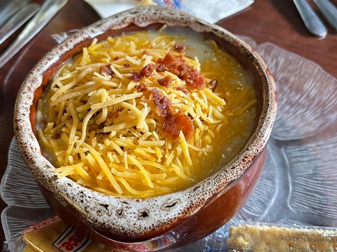 This isn't just potato soup—it's a warm hug in a rustic crock, topped with cheese and bacon because sometimes more really is more.