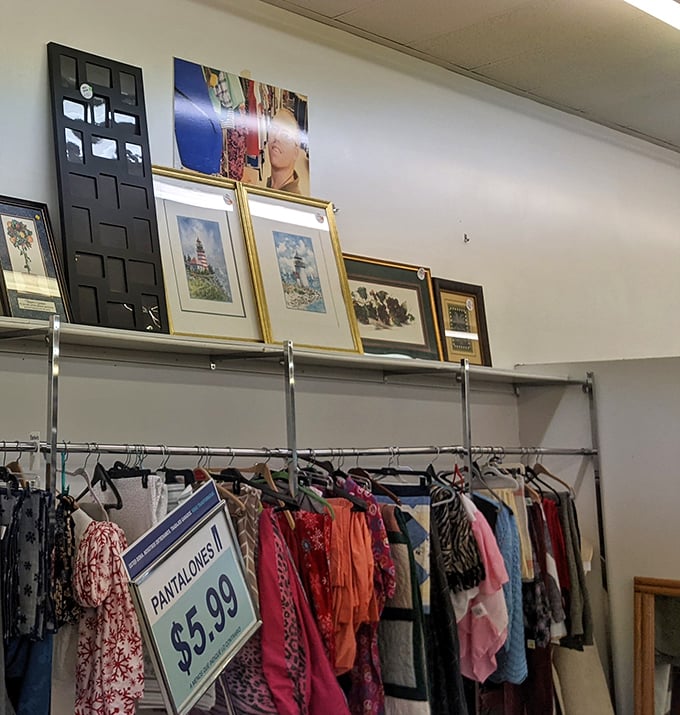 At Goodwill Ankeny, even the quilts seem to tell a story — and the artwork above them? That’s just the encore.