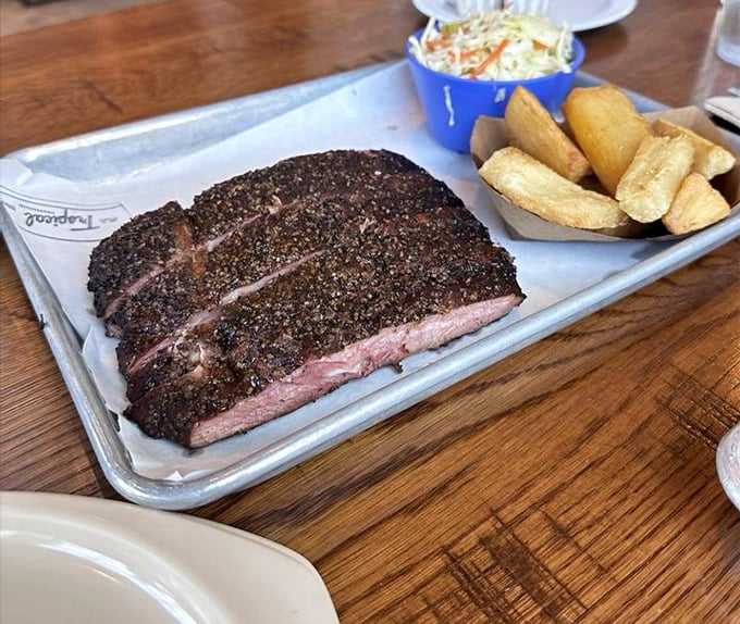 Ribs with a bark so perfect you'll want to frame it, revealing that signature pink smoke ring that BBQ dreams are made of.