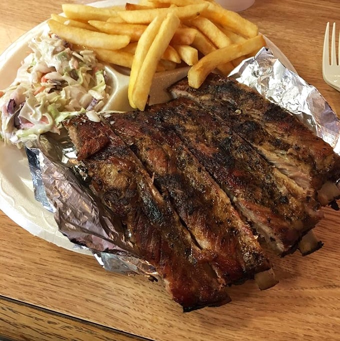 These ribs don't just fall off the bone – they practically leap onto your fork, bringing along perfect bark and a pink smoke ring.