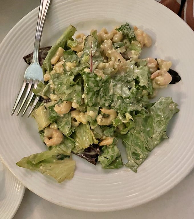 A salad that actually excites – crisp greens playing host to plump shrimp and a dressing that makes "eating healthy" feel like cheating.