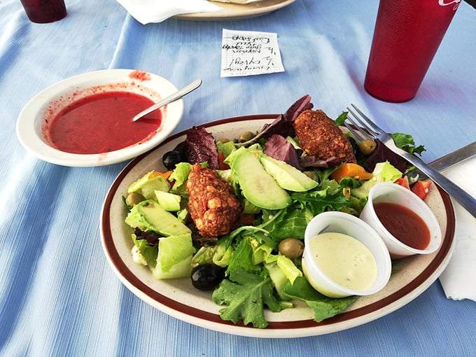 A vibrant salad adorned with falafel and perfectly pink meat proves healthy eating needn't be punishment. Those dipping sauces aren't just accessories—they're necessities.