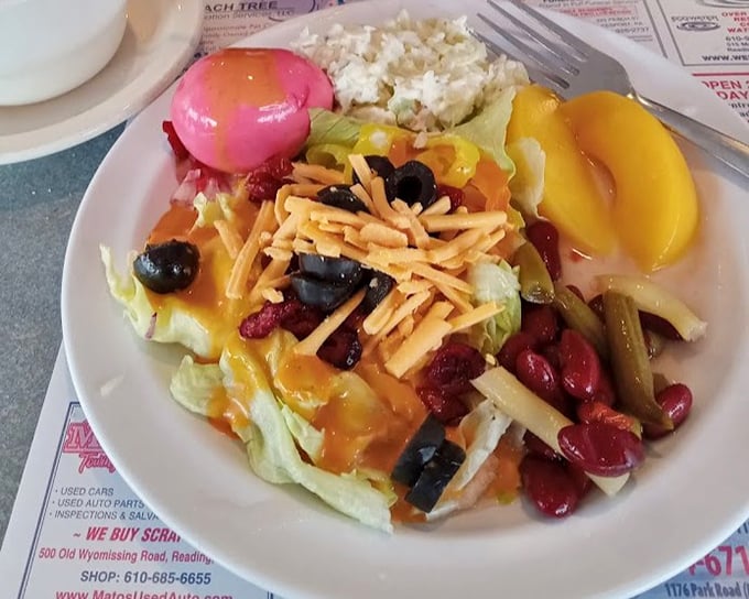 A salad that doesn't apologize for being colorful – cheese, beans, and veggies creating a carnival of flavors and textures.