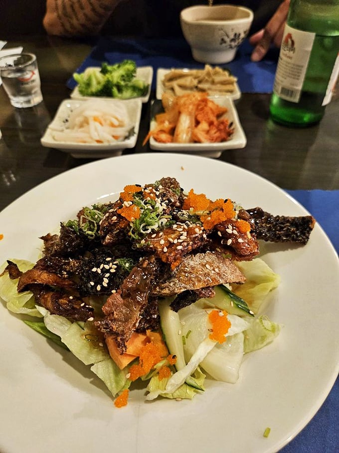 This isn't just any salad – it's a crunchy, savory celebration topped with beef that's been kissed by fire and sesame.