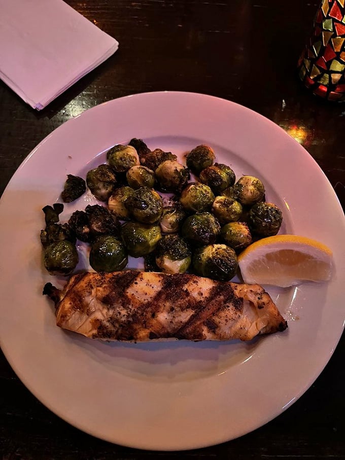 Salmon perfectly grilled alongside Brussels sprouts that even vegetable skeptics would devour – proof that pub food isn't all about heavy indulgence.
