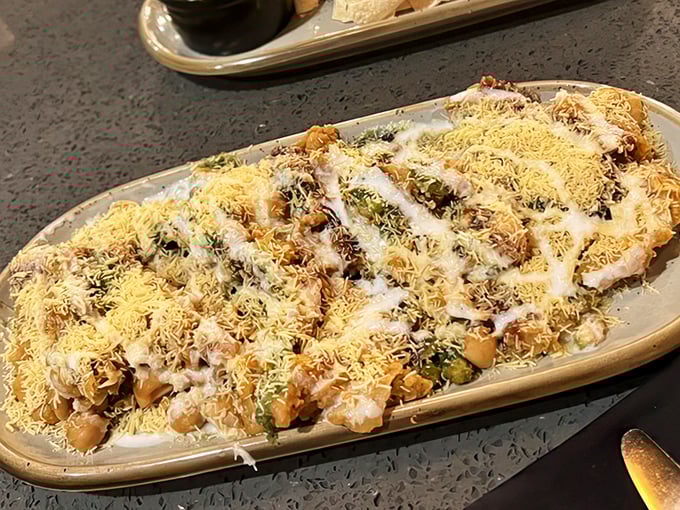 Samosa chaat dressed up like it's going to the Oscars of appetizers.