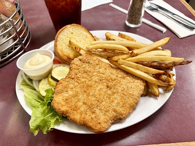 Golden-breaded perfection meets hand-cut fries. This isn't just a sandwich; it's edible nostalgia that tastes like summer afternoons and simpler times.
