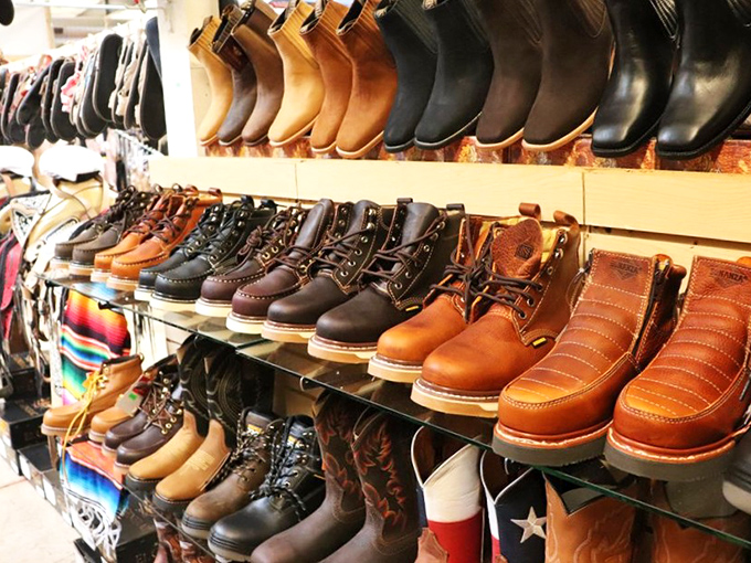Boot displays organized by color gradient, turning practical footwear shopping into an unexpectedly satisfying visual experience for everyone.