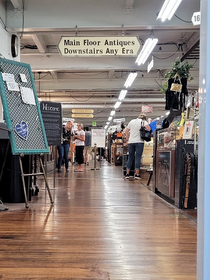 Signs point the way through this wonderland of wares. "Main Floor Antiques, Downstairs Any Era" – like a department store for time travelers.