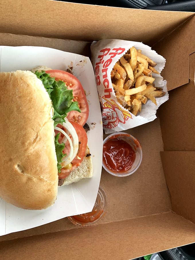Behold the steak sandwich in its natural habitat—simple, unpretentious, and ready to make your car smell heavenly for days.