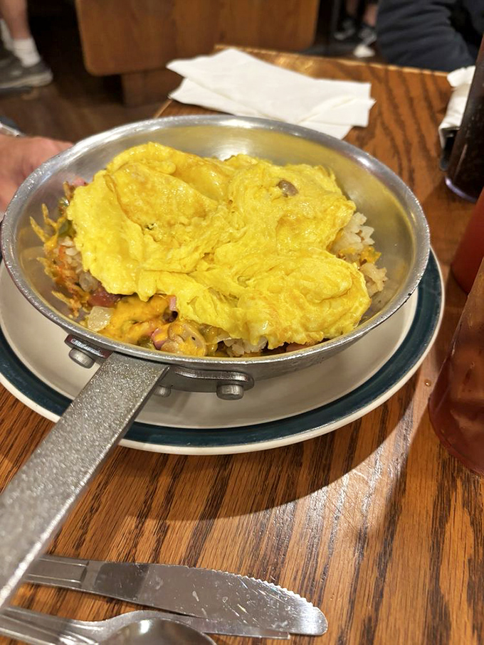This skillet breakfast is what morning dreams are made of—eggs lounging atop a bed of potatoes and various breakfast celebrities.