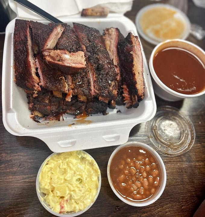 Ribs with the perfect smoke ring, potato salad, and beans—the holy trinity of Memphis barbecue presented with unpretentious perfection.