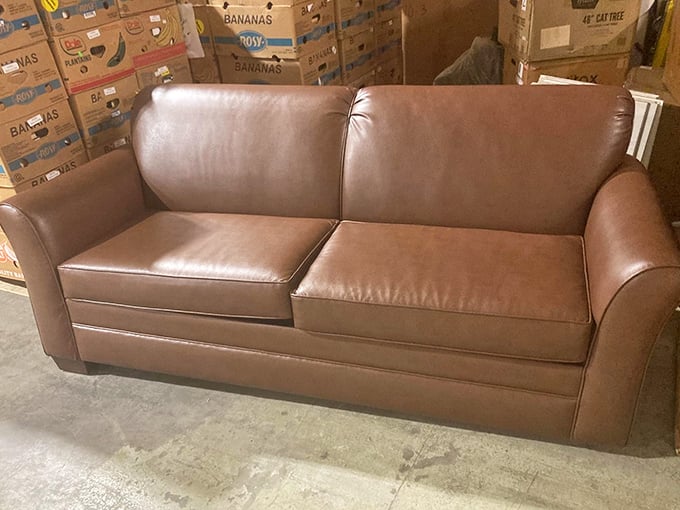 This leather loveseat isn't just pre-loved, it's barely broken in—like finding a vintage Cadillac with only Sunday drive miles on it.