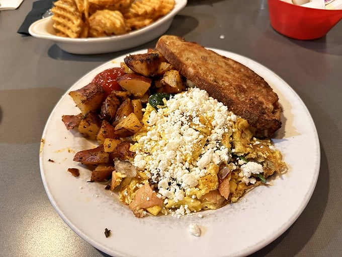 A breakfast scramble that puts your homemade version to shame. That feta cheese crumble isn't just a topping—it's a game-changer.