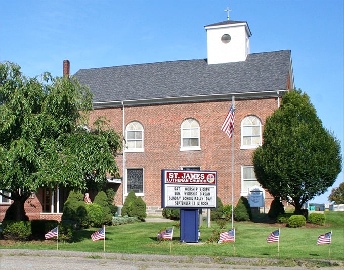 St. James Lutheran Church's brick façade and American flags represent the blend of faith and patriotism that runs deep in Phillipsburg.