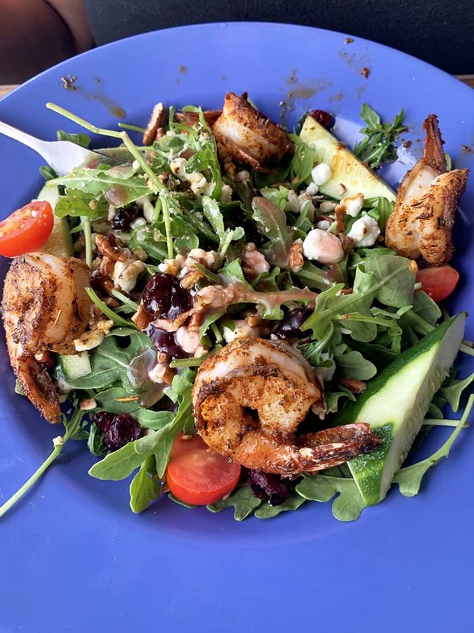 A salad that doesn't feel like punishment—fresh greens playing host to perfectly seasoned shrimp in a brilliant Florida sunshine performance.