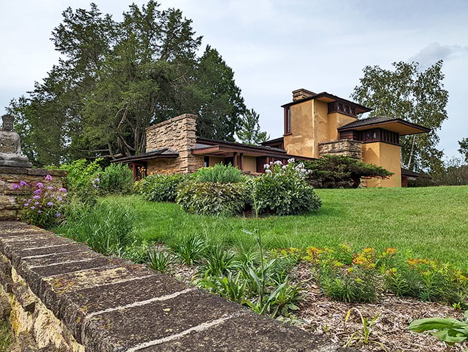 Wright's Taliesin emerges from the landscape like it grew there naturally—the ultimate example of "location, location, location" in architectural form.
