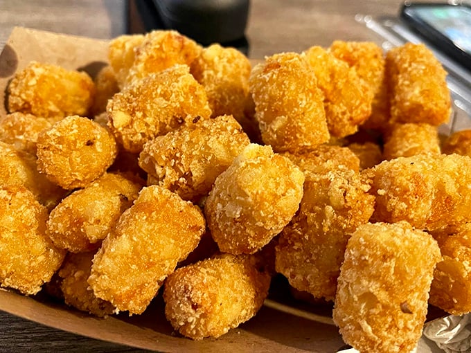 Golden-brown tater tots that crunch like childhood memories—crispy outside, fluffy inside, and impossible to stop eating once you start.