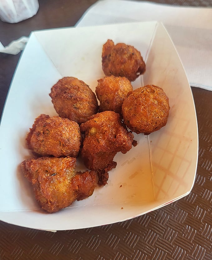 These golden-fried puffins aren't just side dishes—they're little orbs of potato perfection that could easily become your new obsession. Trust me on this.