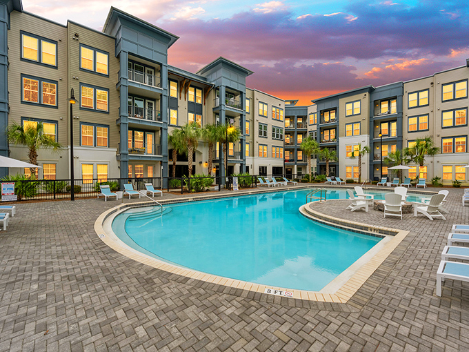 Modern luxury meets coastal comfort at these poolside apartments—where "roughing it" means forgetting your sunscreen.