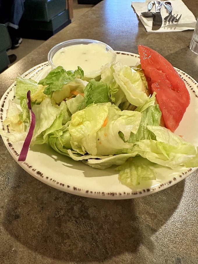 Even the garden salad gets the respect it deserves – fresh, crisp, and served with the kind of dressing that makes vegetables worth eating.