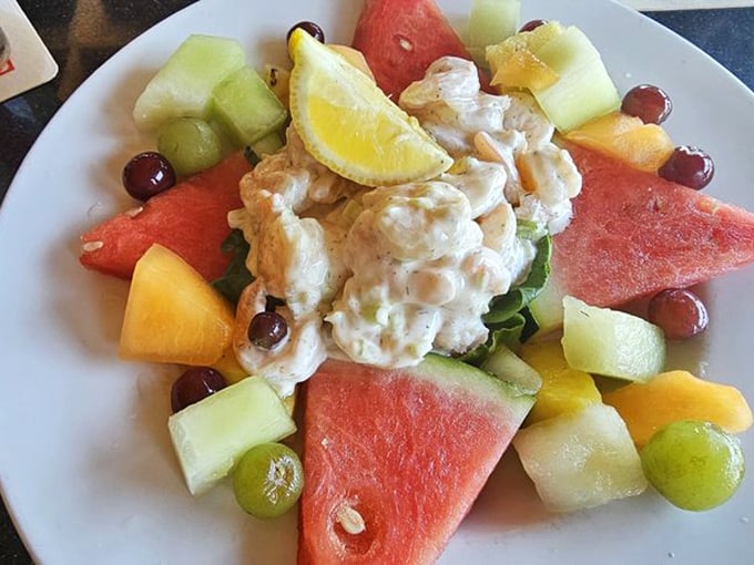 A fruit salad playing host to creamy shrimp salad—like finding an oasis in a tropical garden. Summer on a plate.