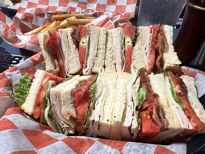 Layer upon layer of club sandwich perfection—like a skyscraper of flavor that would make any lunch hour memorable.