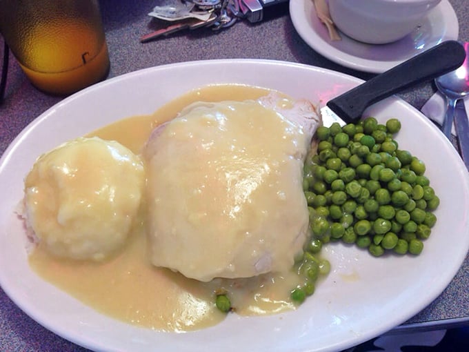 Turkey dinner that tastes like Thanksgiving without the family drama. Those peas aren't just a garnish—they're the pop of color your Instagram needs.