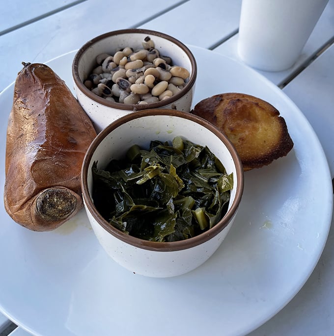 A veggie plate that proves side dishes deserve center stage – collards, black-eyed peas, and a sweet potato that's living its best life.