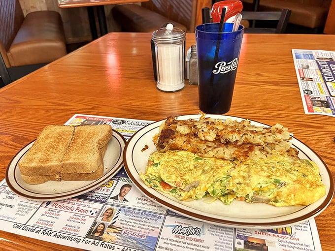 Breakfast of champions: a veggie-packed omelet alongside crispy home fries and toast—fuel for exploring Delaware's coastal treasures.