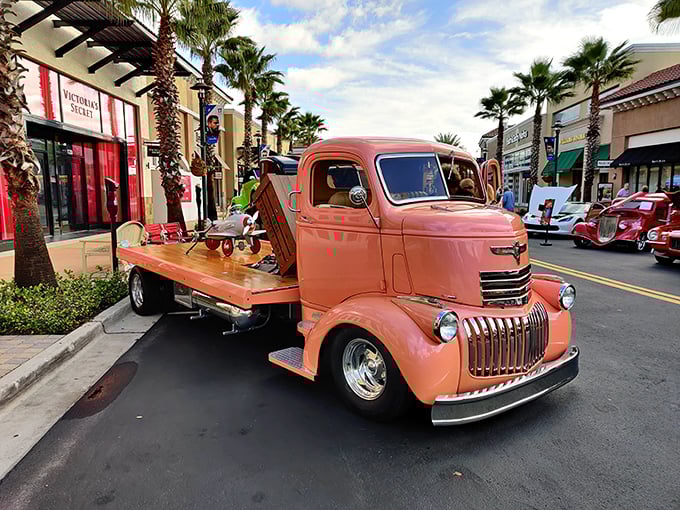 This vintage coral truck isn't just transportation—it's a rolling time capsule bringing classic Americana to the palm-lined avenues of modern retail.
