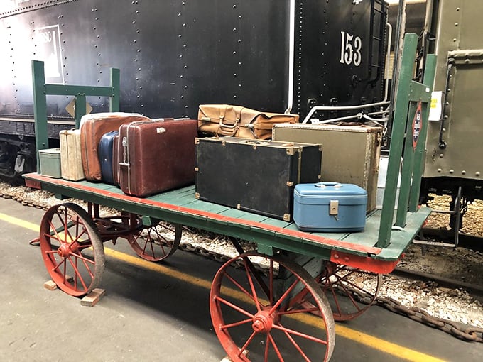 A perfectly preserved luggage cart loaded with vintage suitcases—the Instagram-worthy shot that makes you want to pack your bags for a bygone era.