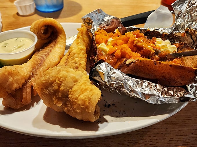 Seafood and loaded baked potato sharing a plate with fried perfection – proof that Bill's isn't just a one-trick pony.