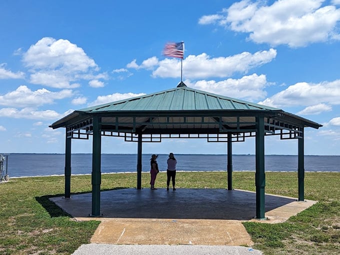 The lakeside gazebo offers shade and panoramic views—perfect for those "I need a moment" escapes from Florida's relentless sun.