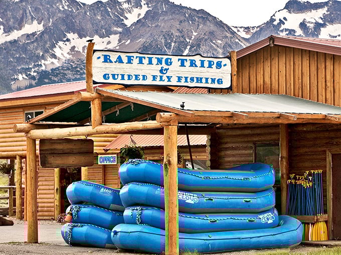 Blue rafts stacked like adventure pancakes, ready to serve up whitewater thrills with a side of "remember that time we almost flipped?"