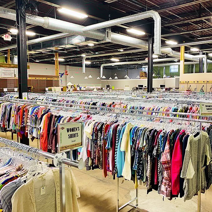 Women's clothing sections spanning multiple racks prove one person's closet purge is another's wardrobe jackpot waiting to happen.